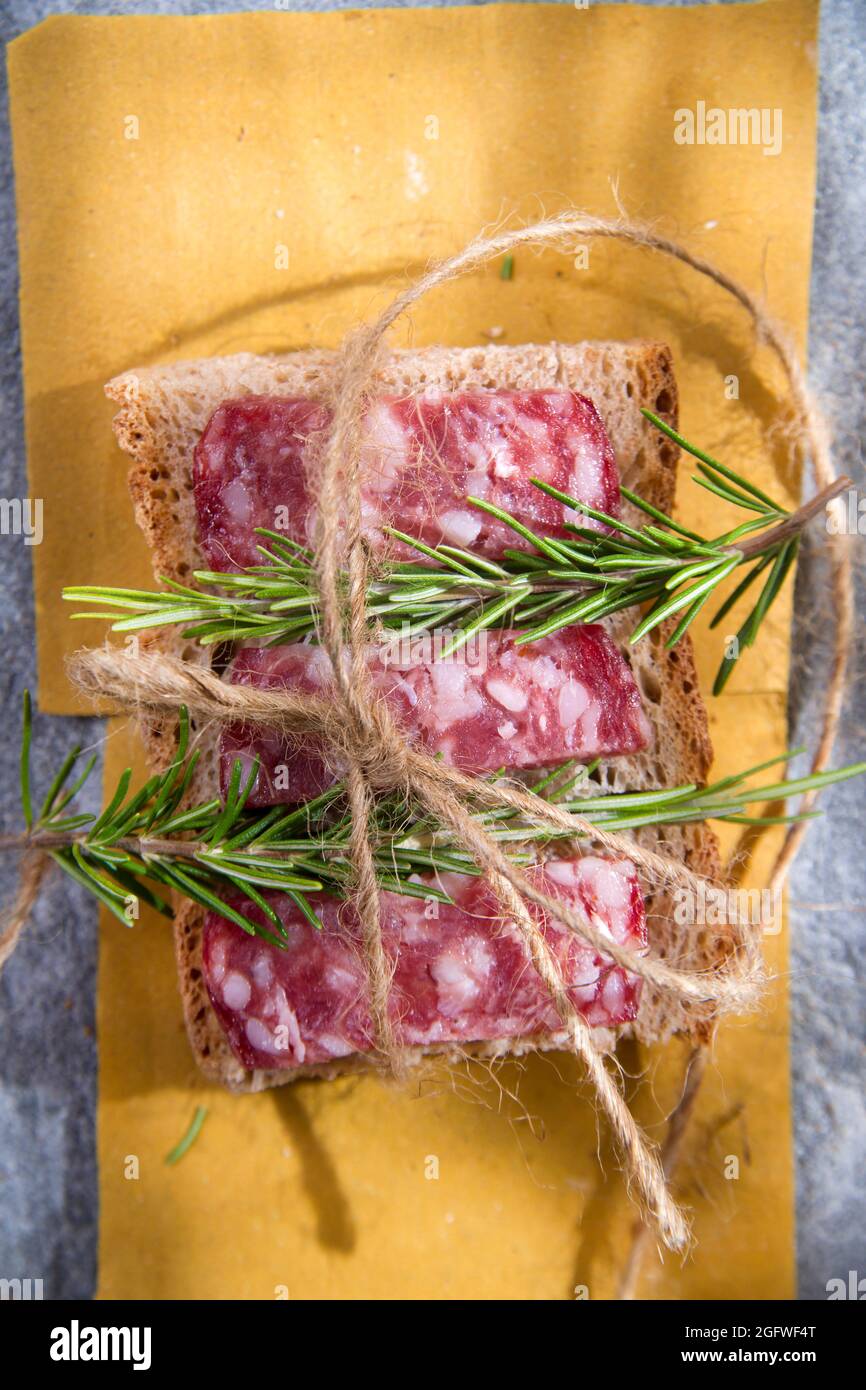 Presentation of a snack of bread and salami Stock Photo - Alamy