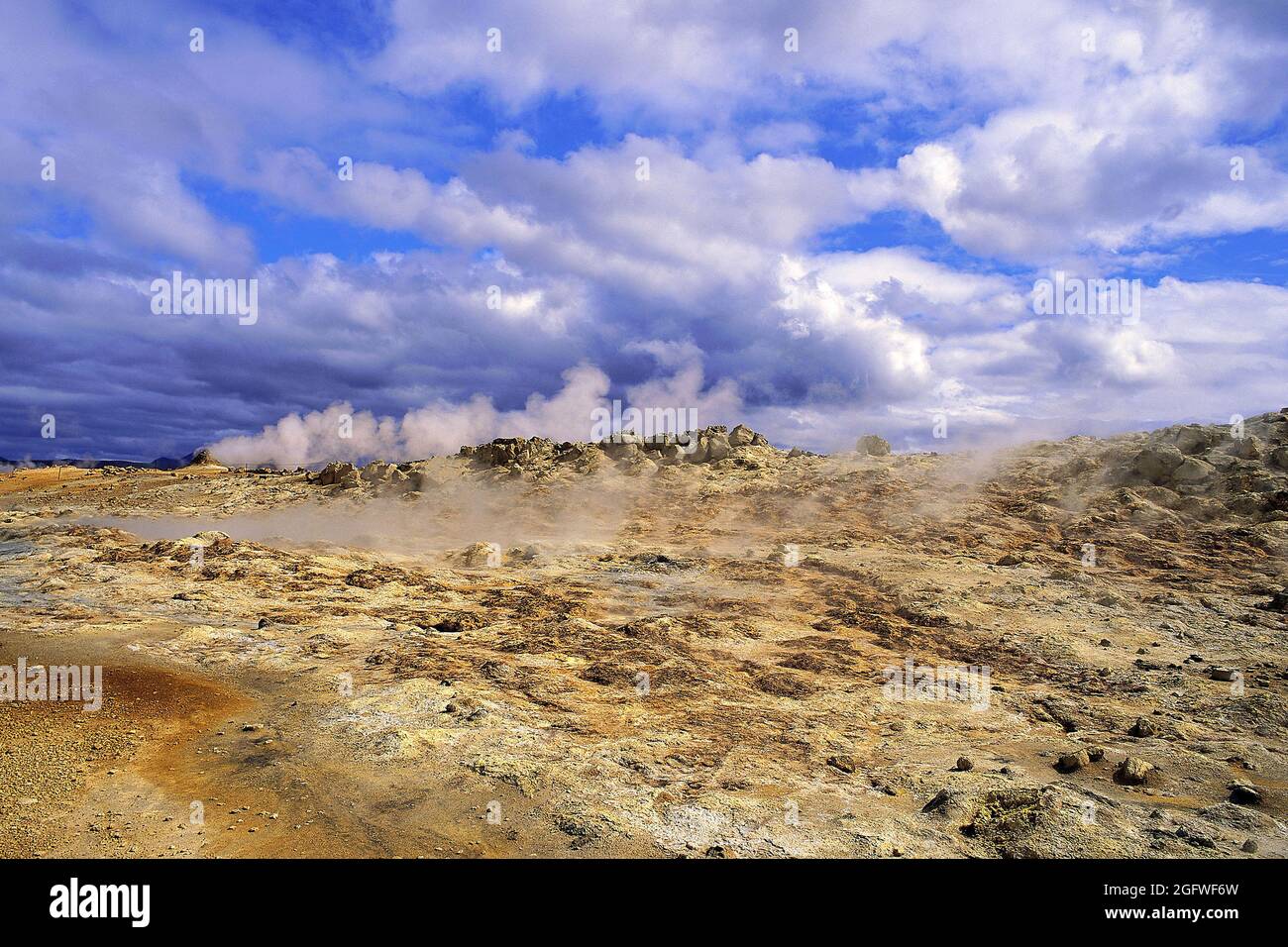 Rough, rocky landscape with geothermal fumarole and steam, Iceland ...