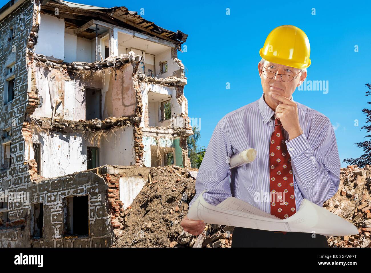 architect with construction plan and hard hat, building demolition in ...