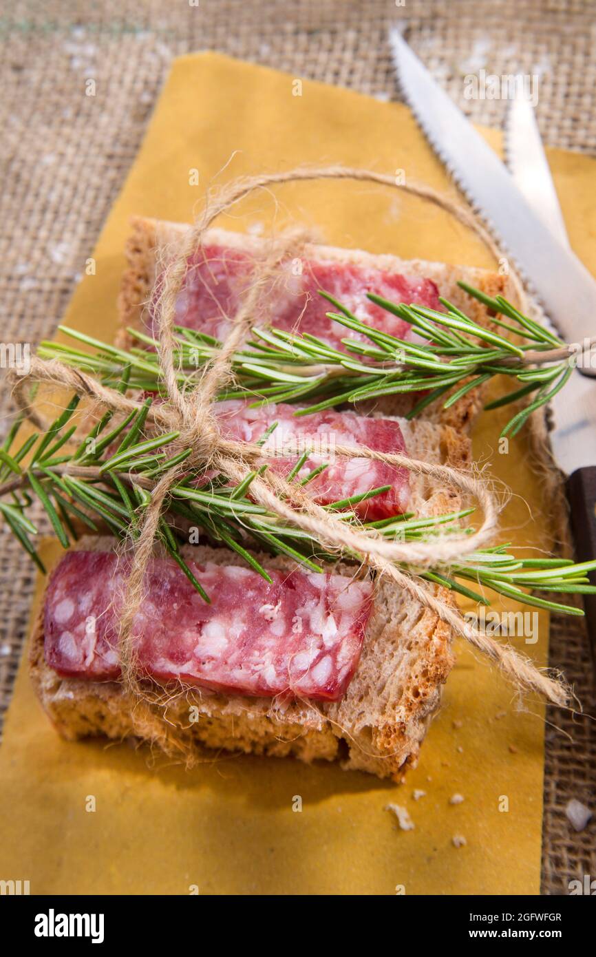 Presentation of a snack of bread and salami Stock Photo - Alamy