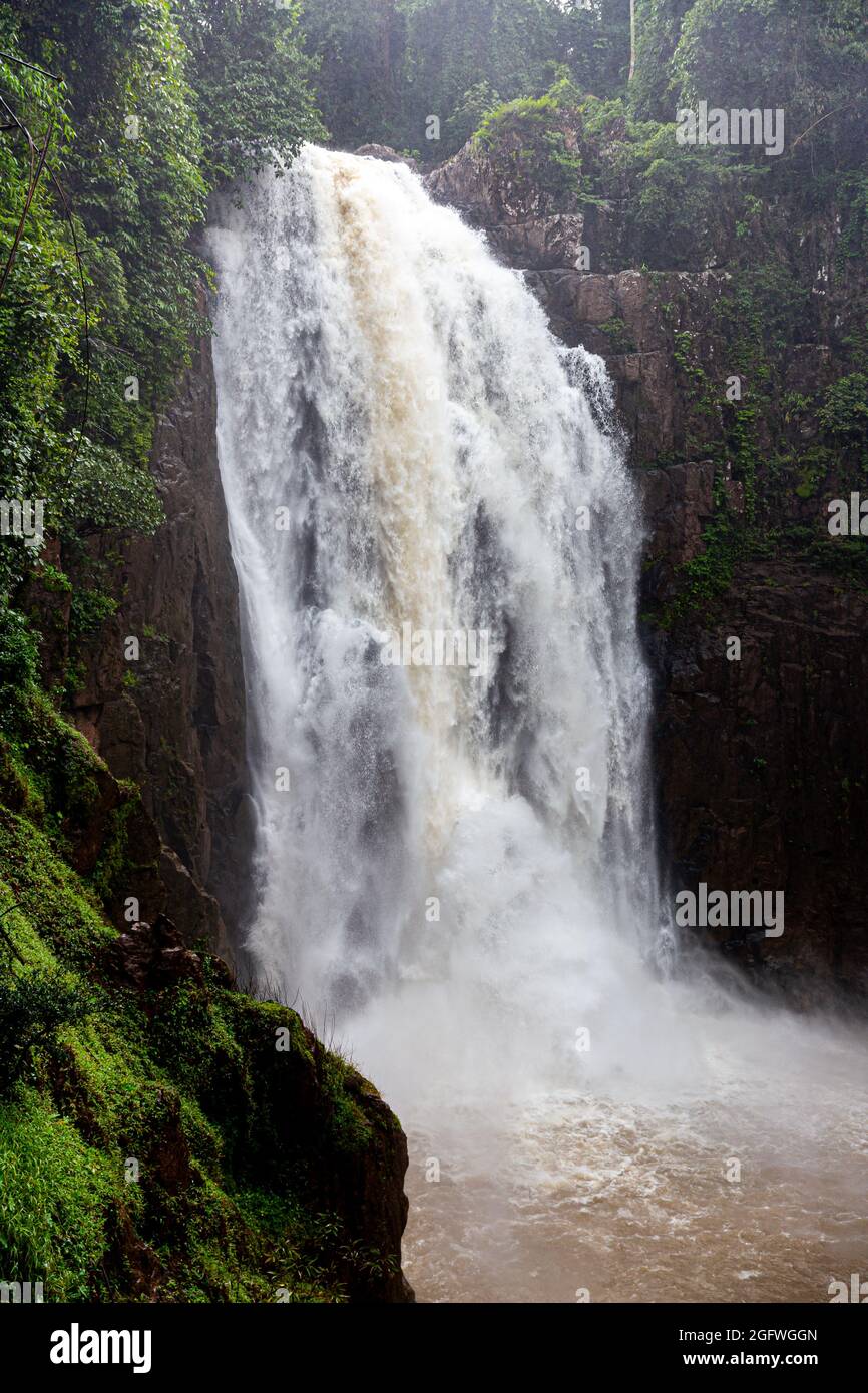 Big waterfall inside tropical evergreen rainforest of Thailand with ...