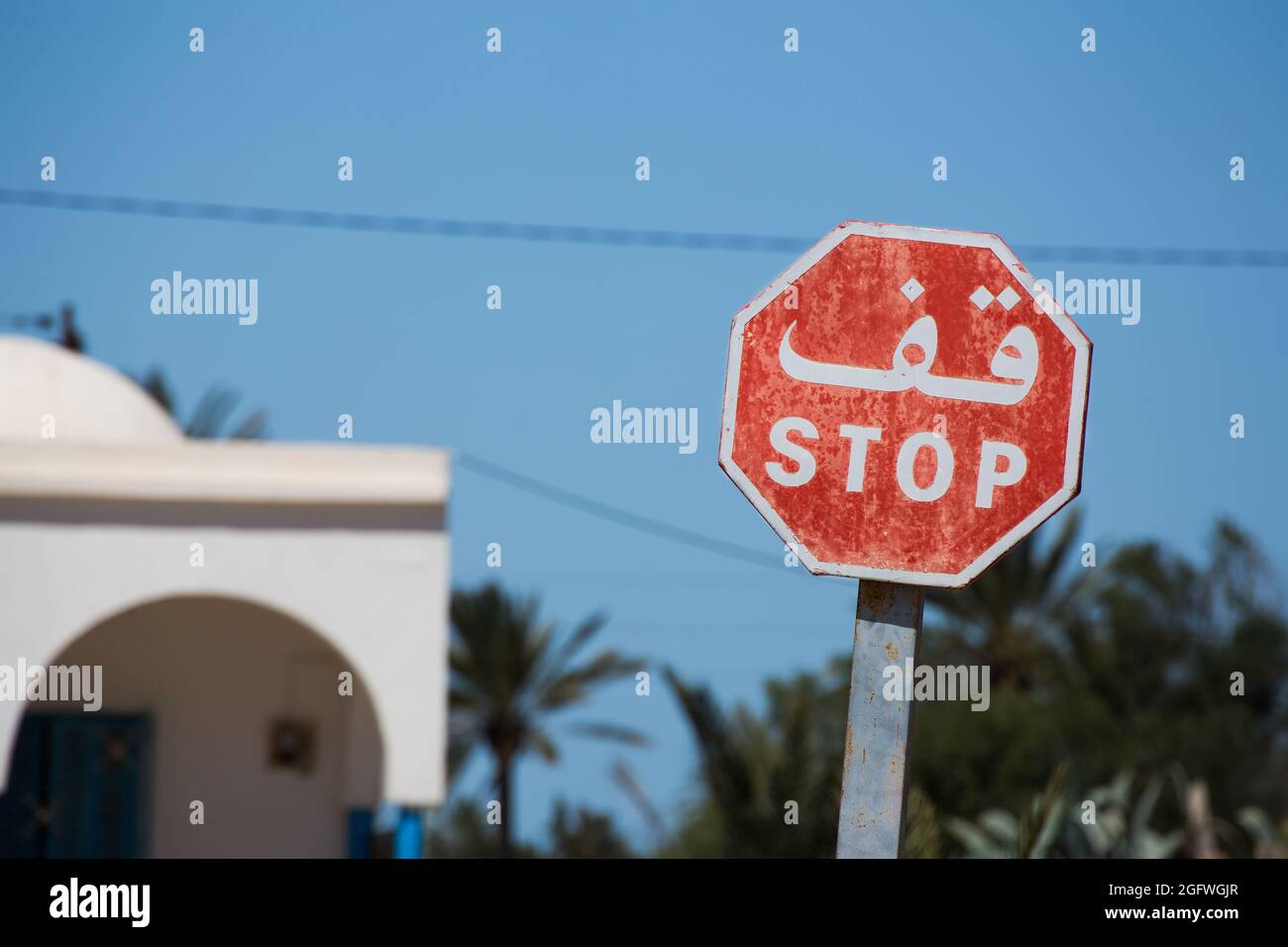 Stop sign with Arabic letters under the sky Stock Photo - Alamy