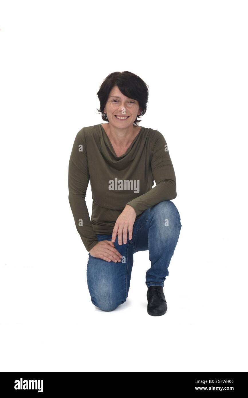 front view of a woman crouching on white background Stock Photo - Alamy
