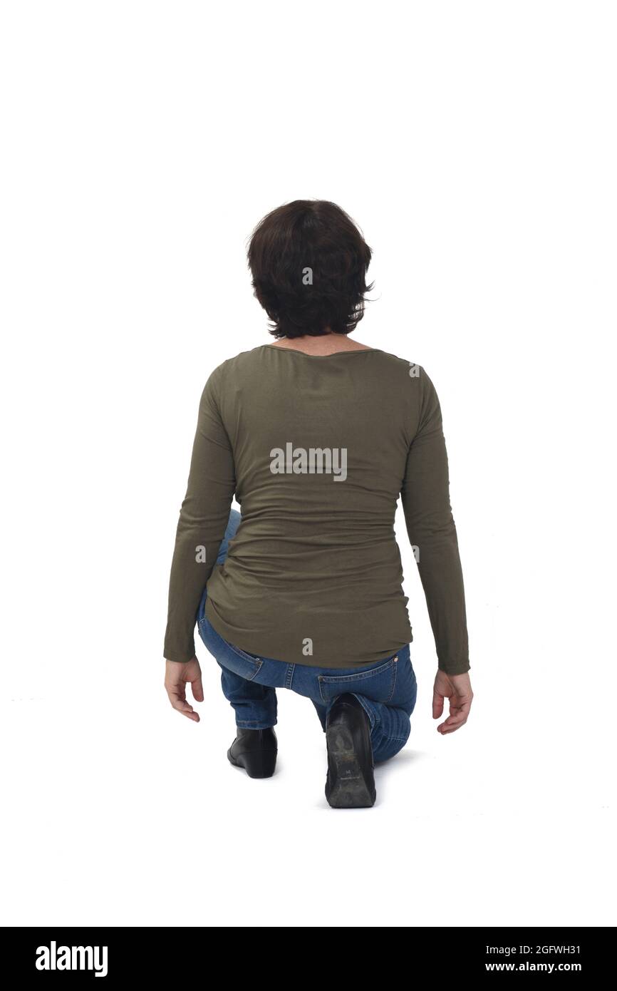 rear view of a crouching woman on white background Stock Photo - Alamy