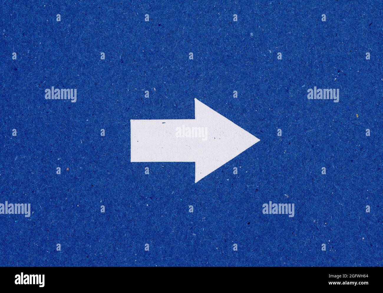 white right arrow sign on blue background Stock Photo - Alamy