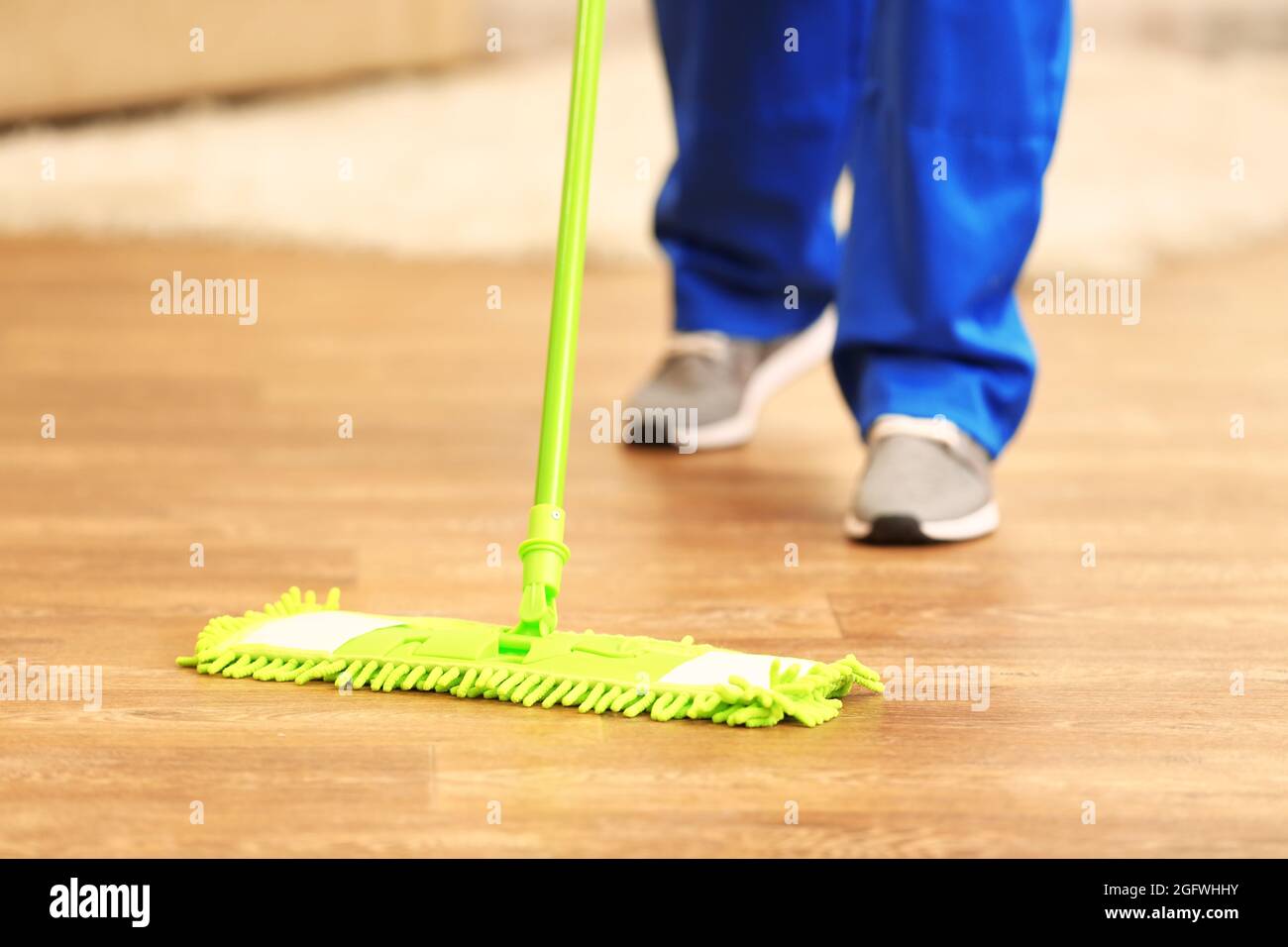 Person moping hi-res stock photography and images - Alamy
