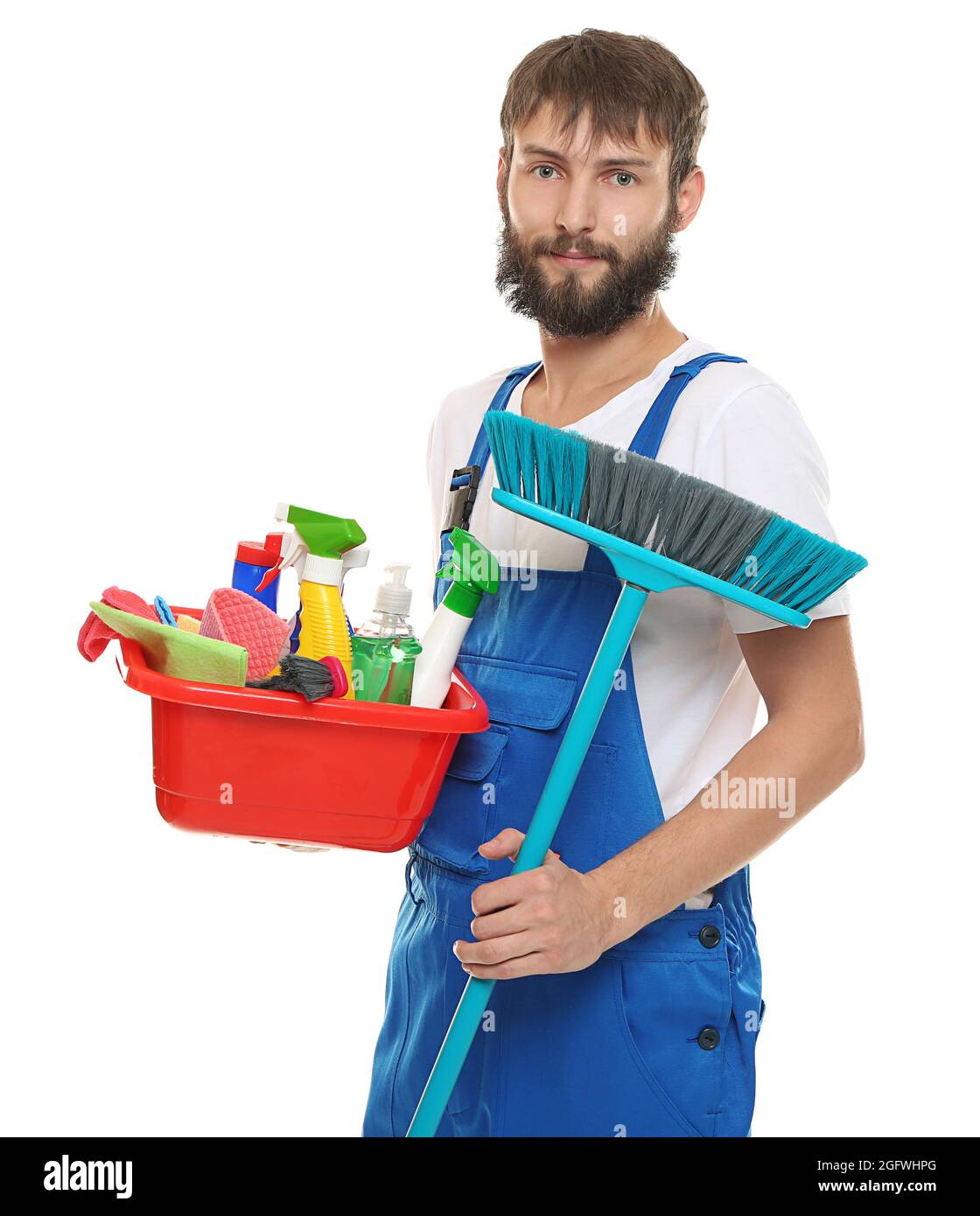 Young man with cleaning supplies on white background Stock Photo - Alamy