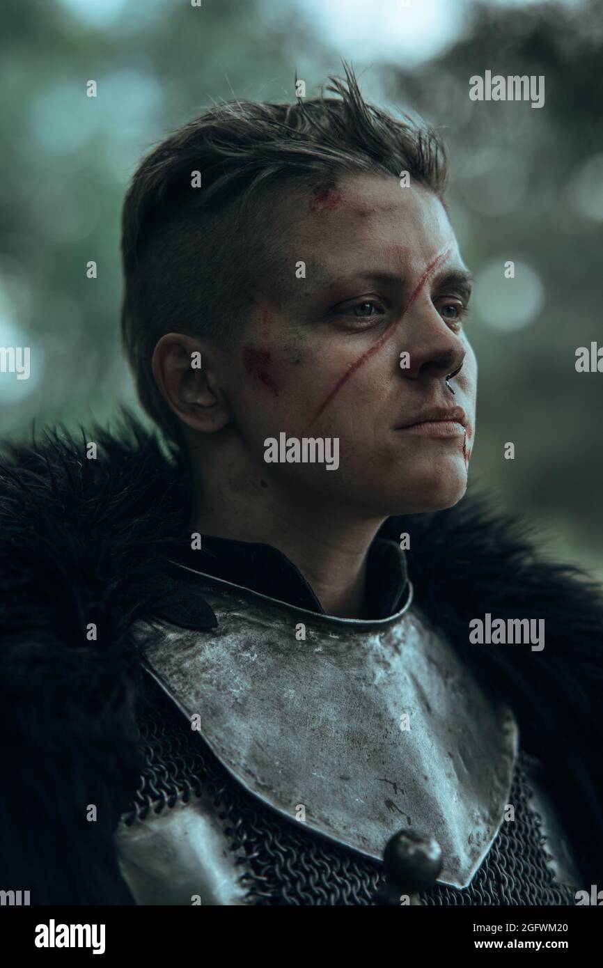 Portrait of medieval warrior knight in chain mail armour with bloody ...