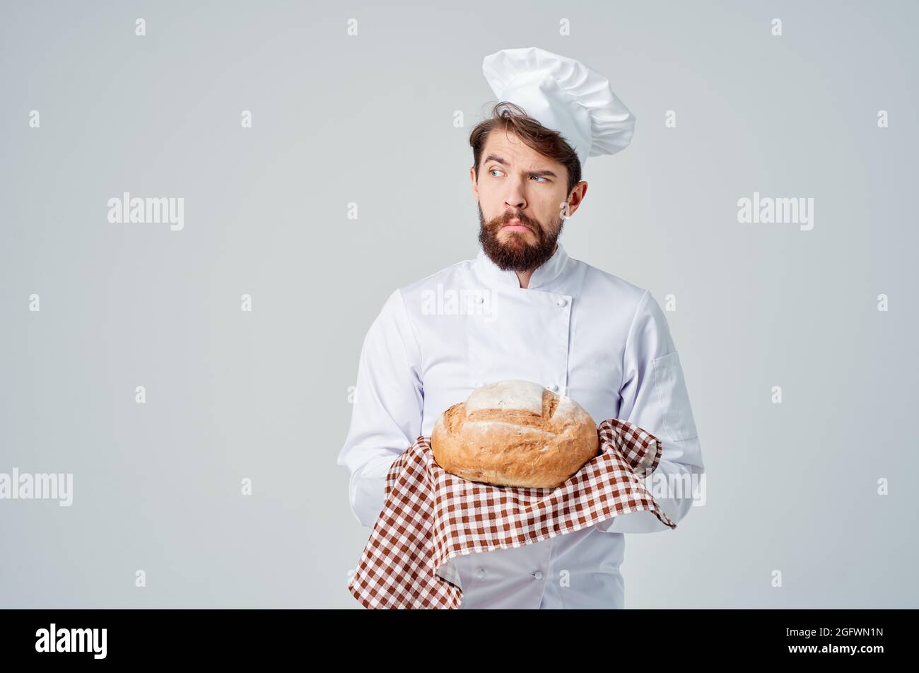 bearded man chef with bread in hand culinary industry Stock Photo - Alamy