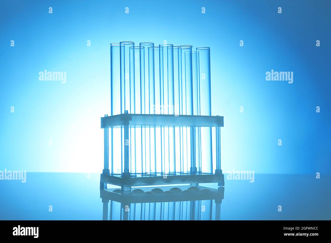 Test tubes on colour background Stock Photo - Alamy