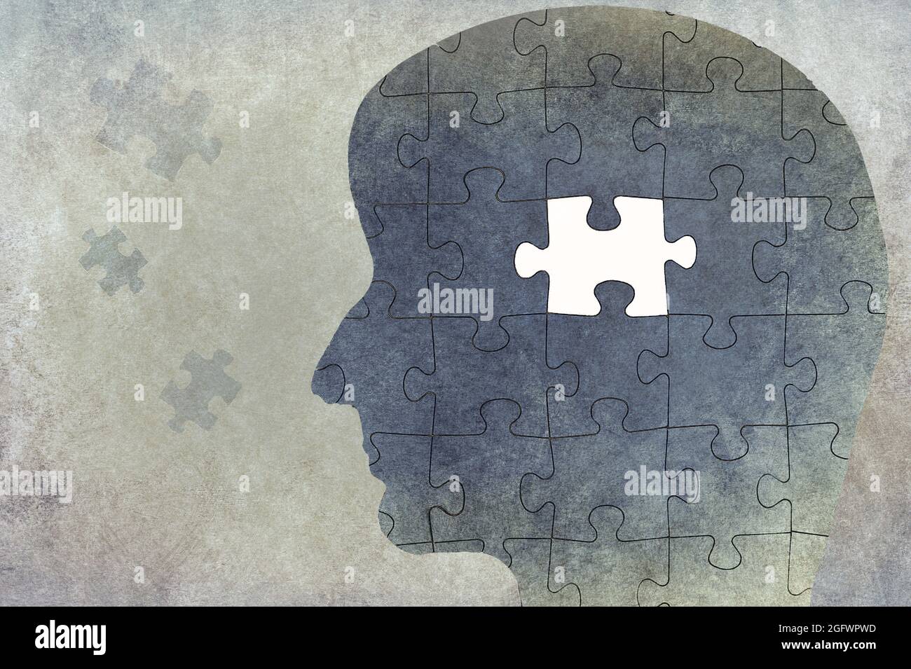 Silhouette of a head on a textured background, puzzle with missing part ...