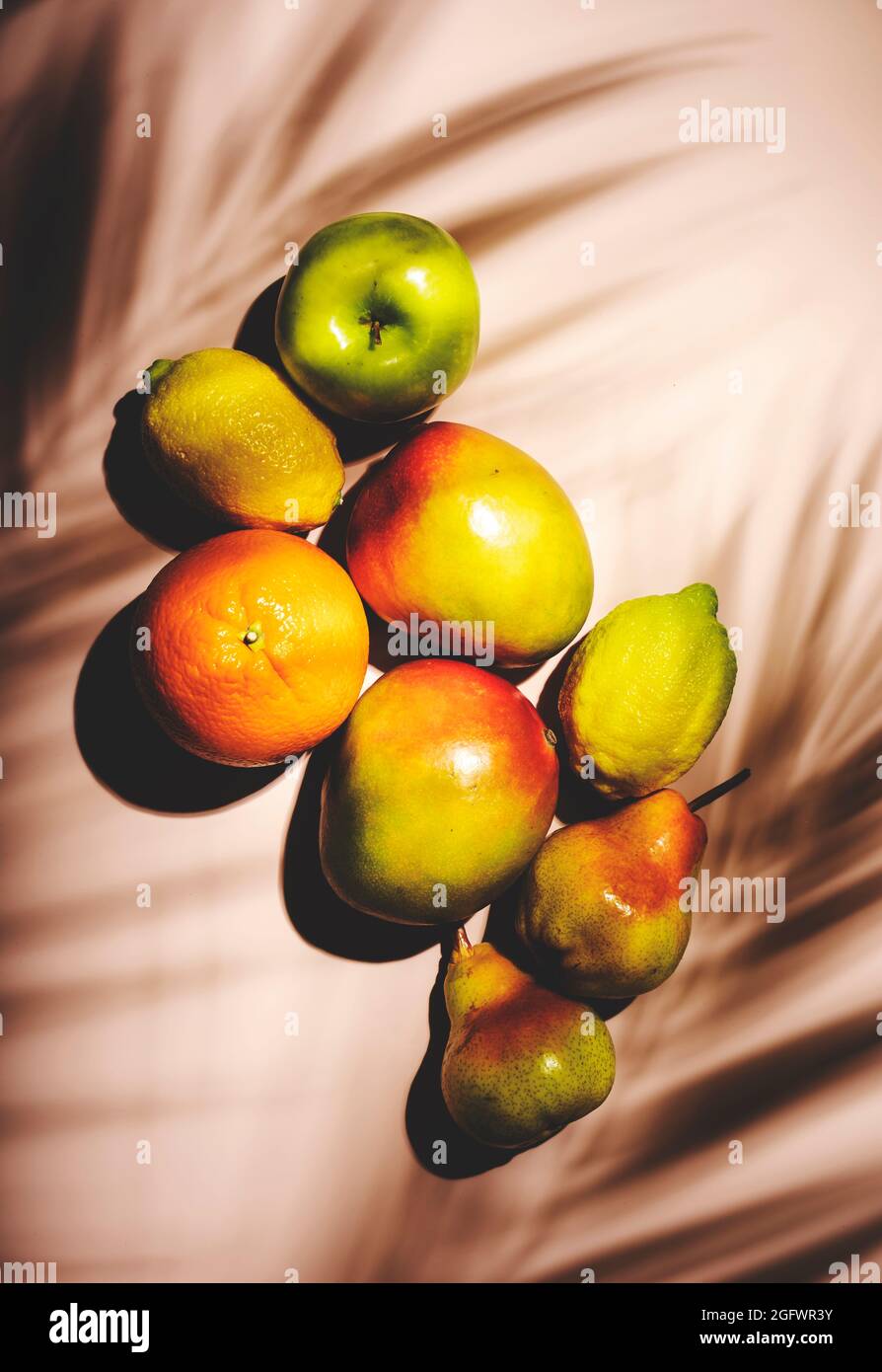 Summer fruits top view. Contemporary still life, lime green background ...