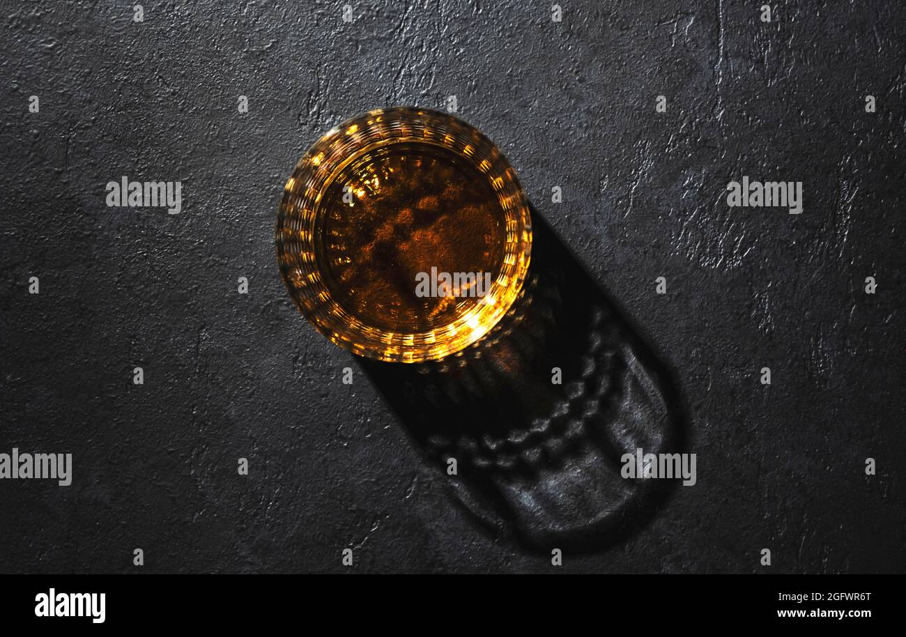 American bourbon whiskey in glasses and bottle, black background with ...