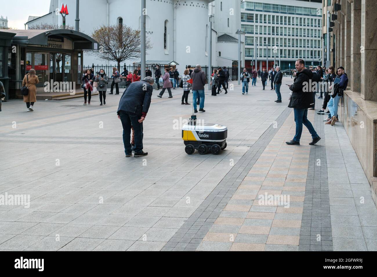 Delivery rover on busy street Stock Photo - Alamy