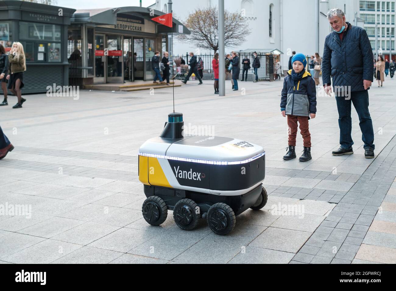 Delivery rover on busy street Stock Photo - Alamy