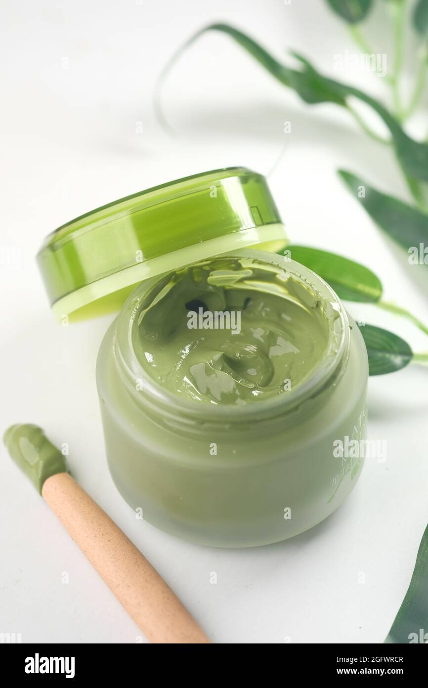 bubble clay mask in container on white background Stock Photo - Alamy