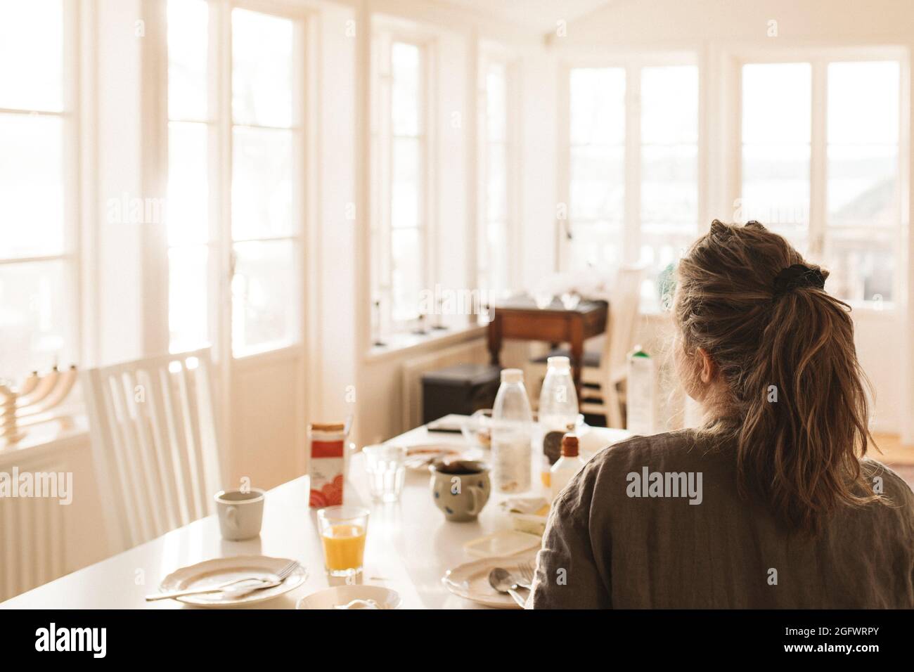 Woman table rear view hi-res stock photography and images - Alamy