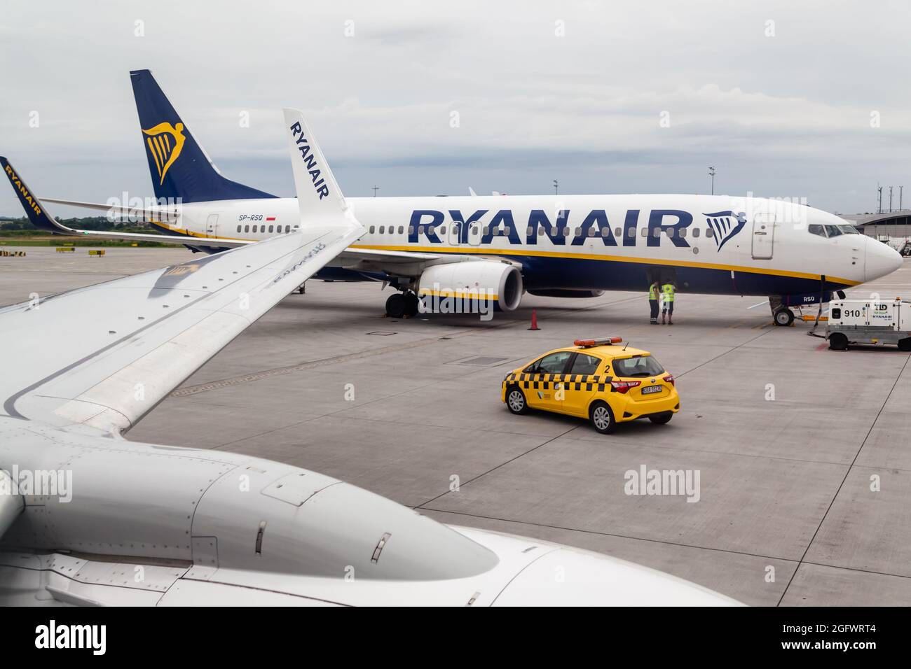 Ryanair Airlines Airbus A320 seen on the landing area with a safety car ...