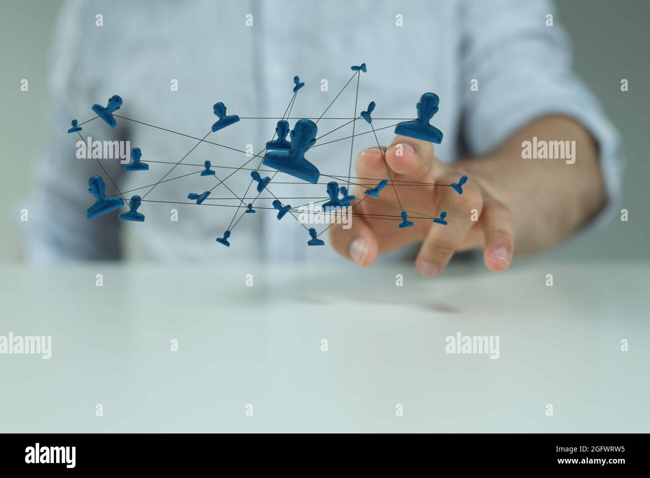 Hand touching icons connected to each other - the concept of digital ...