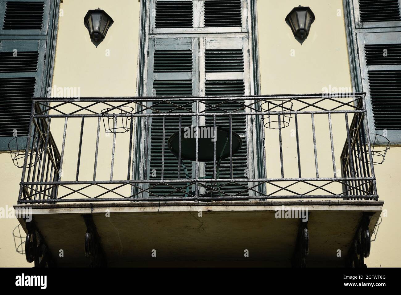 Old Neoclassical house balcony with a handcrafted wrought iron railing ...
