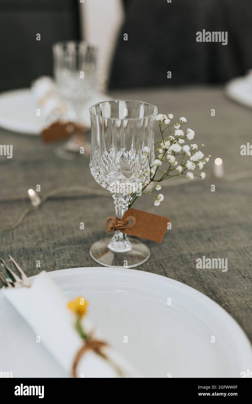 Cristal wineglass with name tag Stock Photo - Alamy