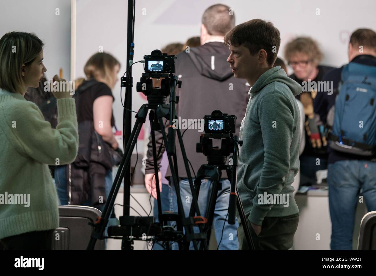 Camera operators speaking during work Stock Photo - Alamy