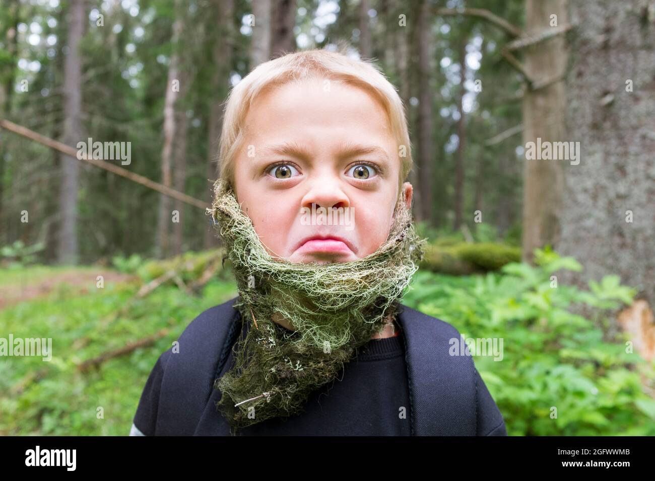 Boy looking at camera Stock Photo - Alamy