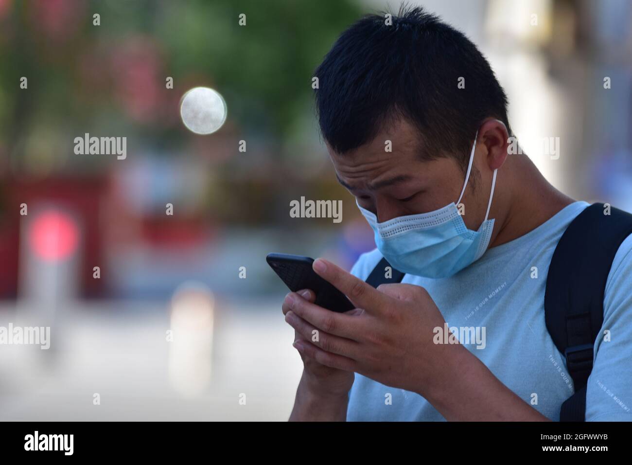 BEIJING, CHINA - AUGUST 27, 2021 - People use smartphones at the ...