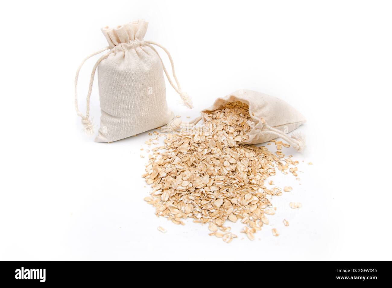 Bag of rolled oats on a white background Stock Photo - Alamy