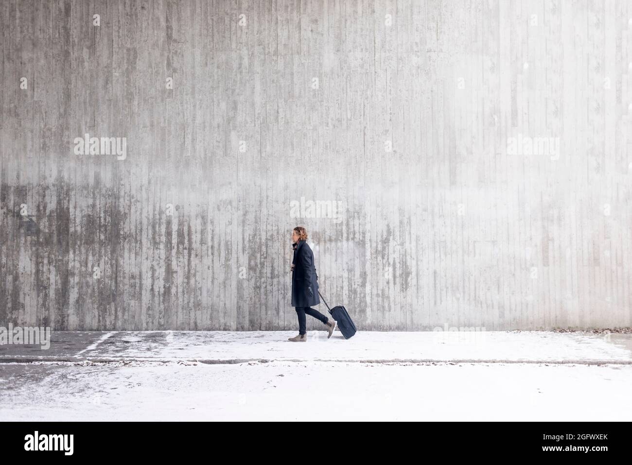 Man walking along wall hi-res stock photography and images - Alamy