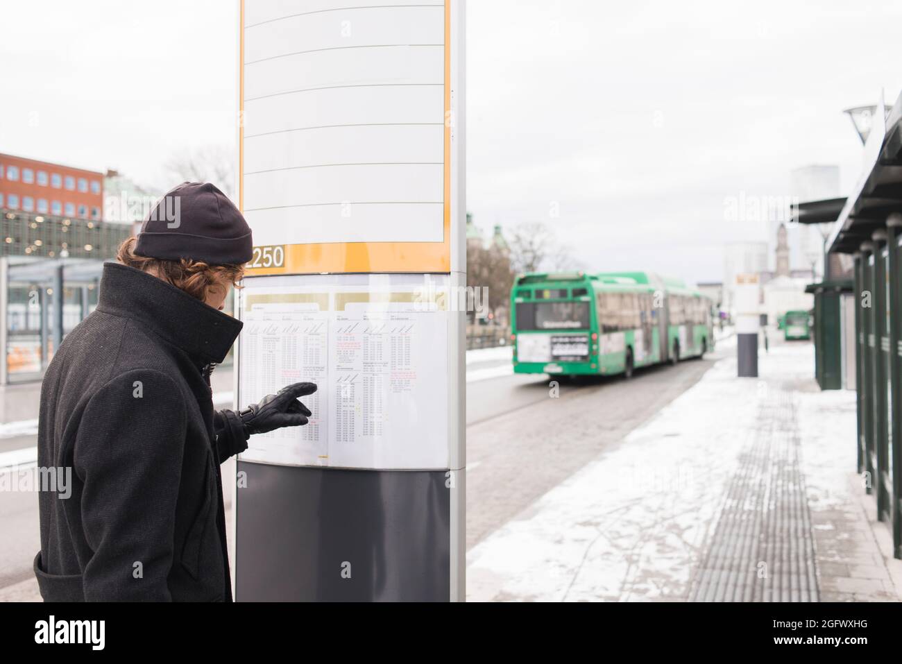 Checking bus timetable hi-res stock photography and images - Alamy