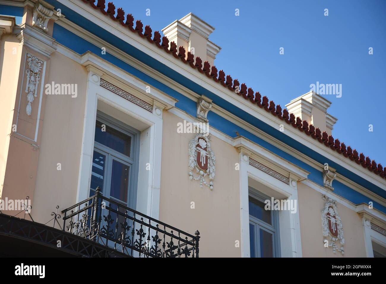 Old Neoclassical building facade with old Athenian Antefix Terracotta ...