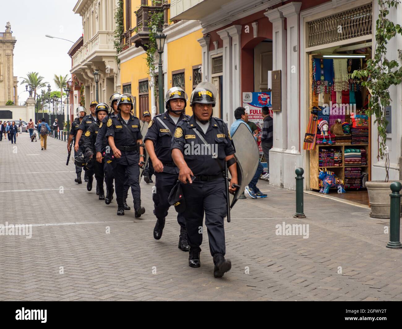 Lima, Peru - Dec, 2019: Policemen in the helmets on the streets of Lima ...