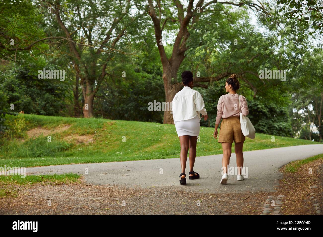 Women walking away pathway hi-res stock photography and images - Alamy