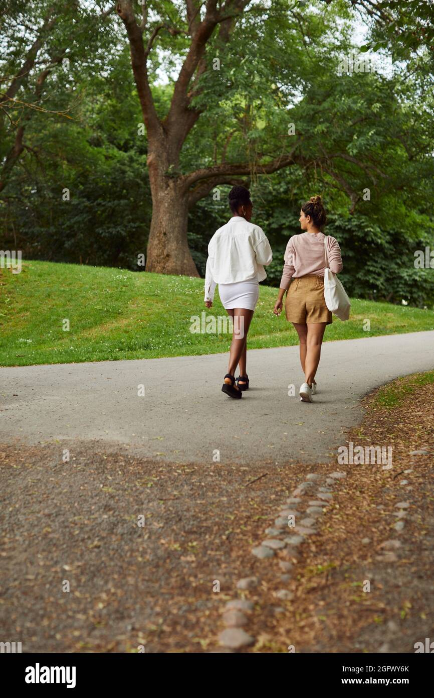 Women walking away pathway hi-res stock photography and images - Alamy