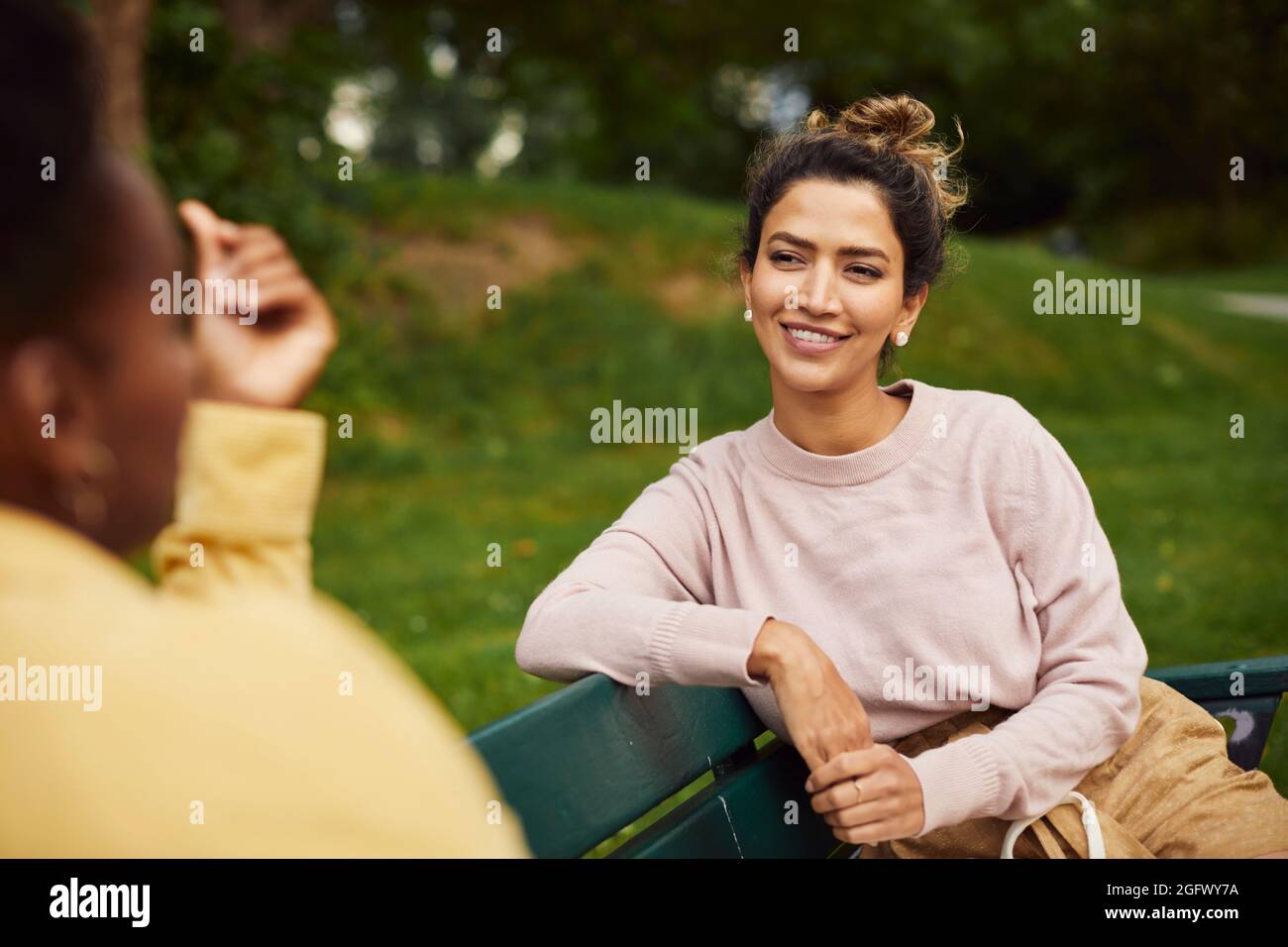Couple talking woman in the background hi-res stock photography and ...