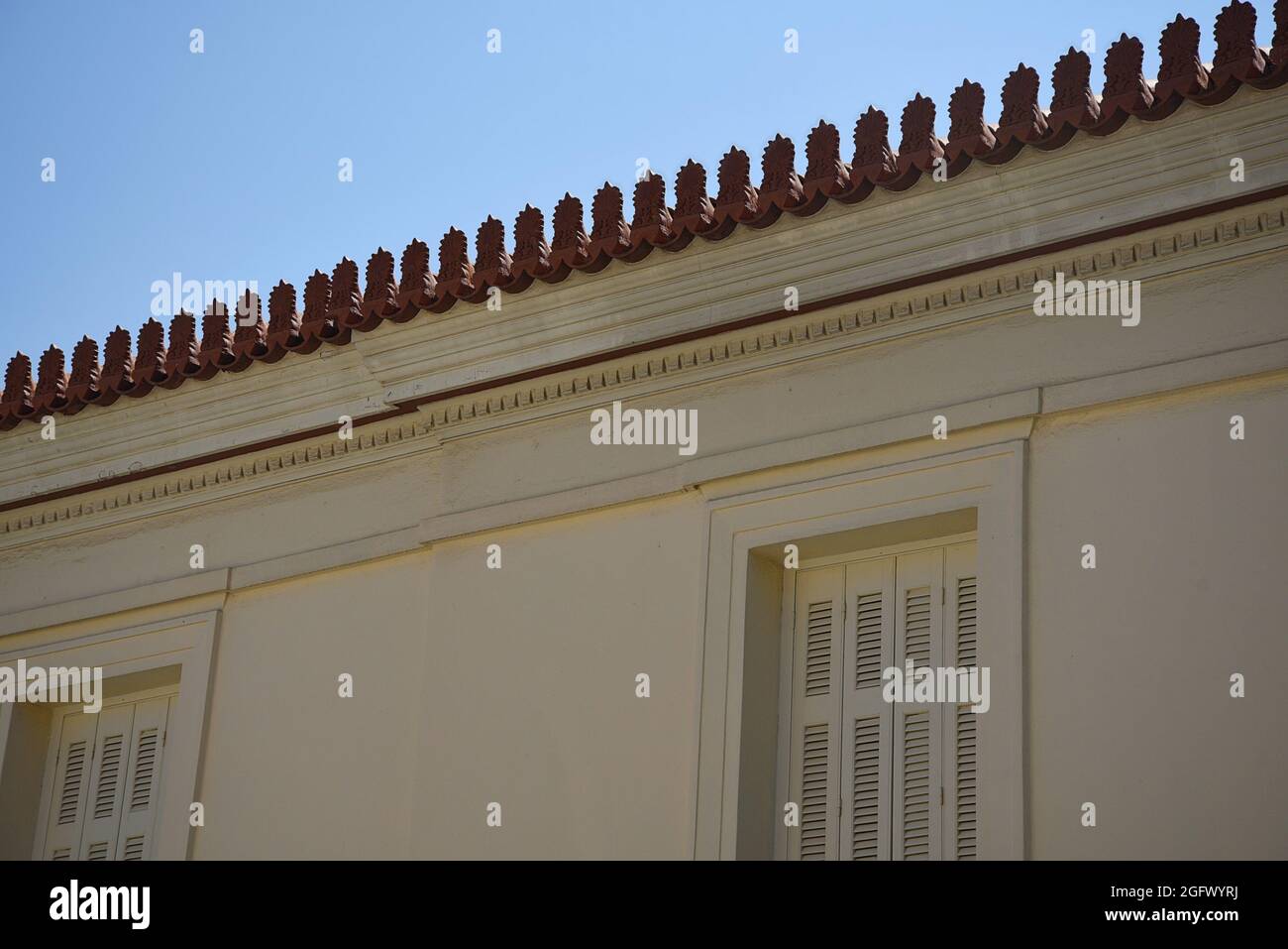 Old Neoclassical house facade with old Athenian Antefix Terracotta ...