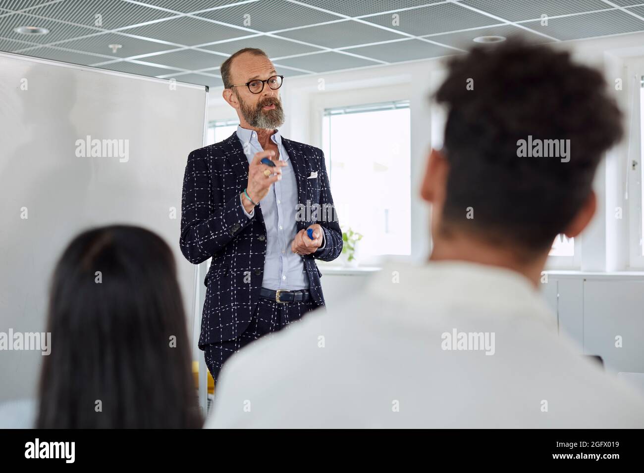 Man talking during business meeting Stock Photo - Alamy