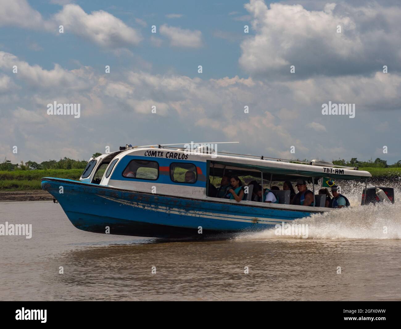 Amazon River, Brazil: - Sep 15, 018: Speed boat with locals on the ...