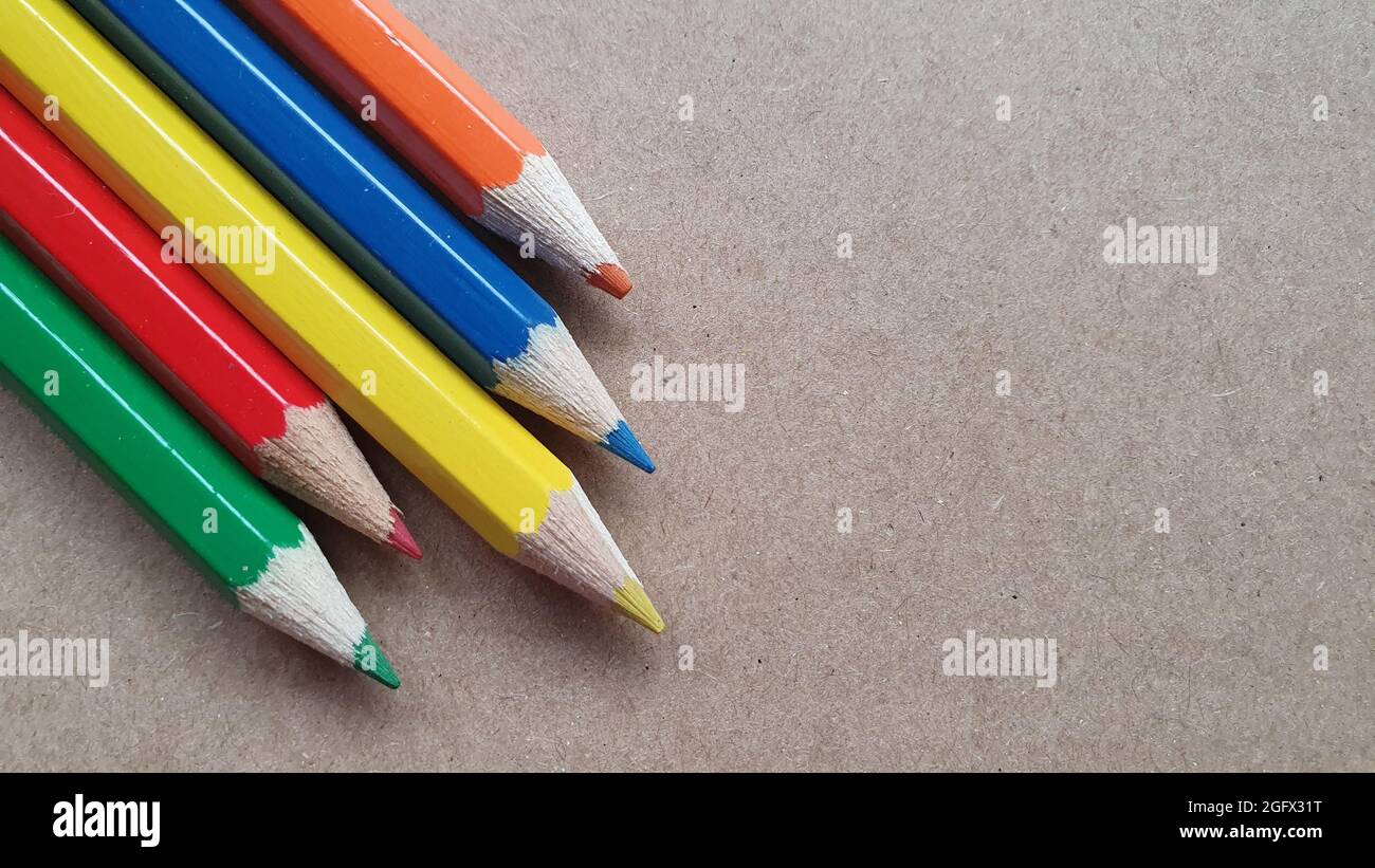 Coloured pencils on neutral background with copy space Stock Photo - Alamy