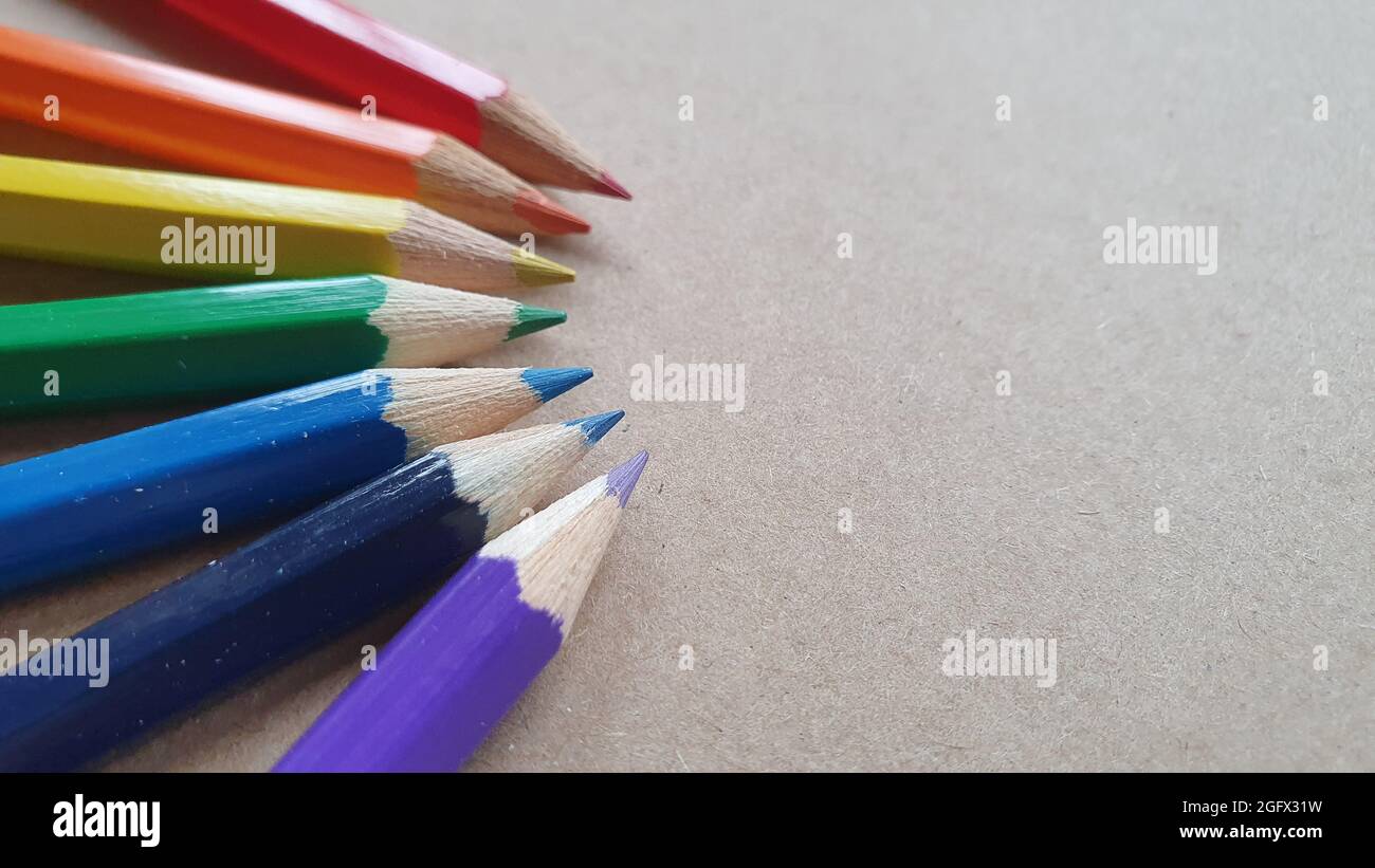 Coloured pencils on neutral background with copy space Stock Photo - Alamy