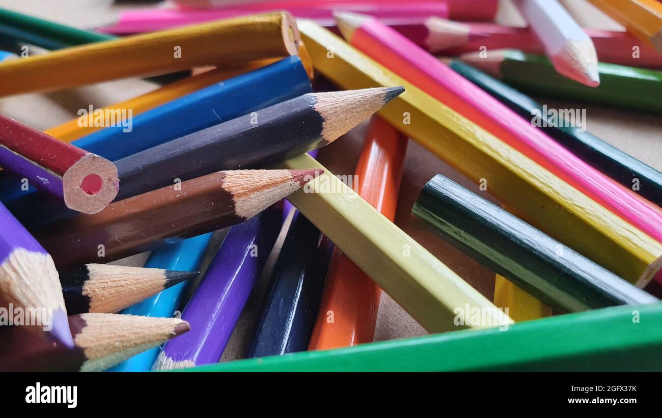 Coloured crayons on neutral background Stock Photo - Alamy