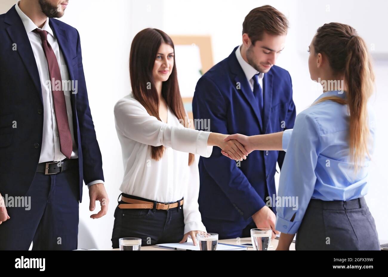 Employer and applicant shaking hands after interview Stock Photo - Alamy