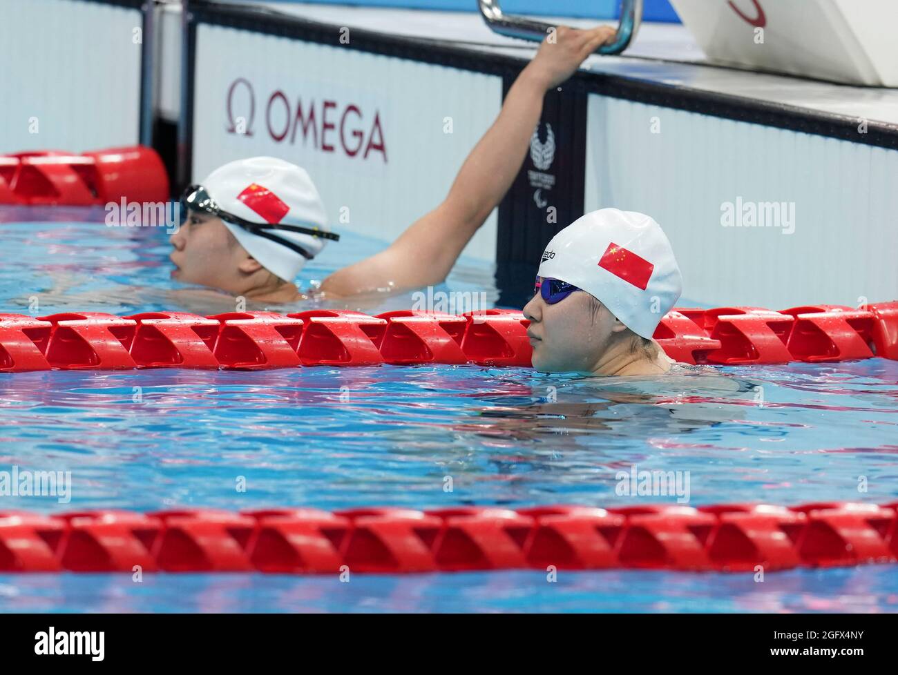 Tokyo, Japan. 27th Aug, 2021. Lu Dong (R) and Cheng Jiao of China react ...