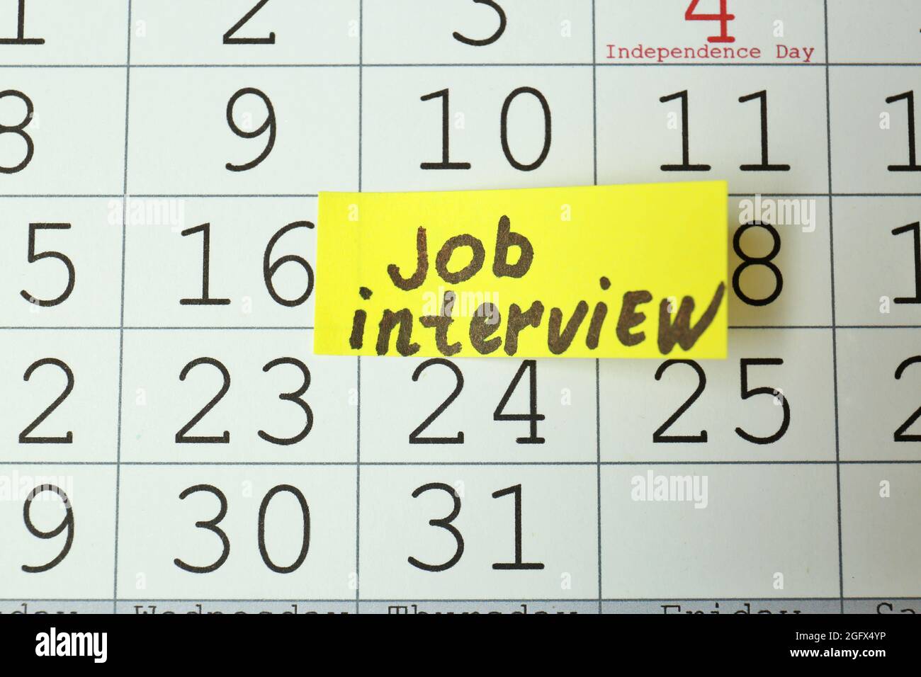 Yellow sticker with job interview reminder on calendar, closeup Stock ...