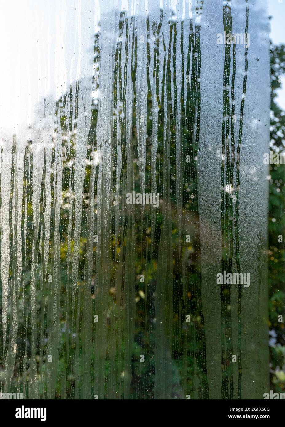 abstract photography with wet and sweaty window, raindrop texture ...