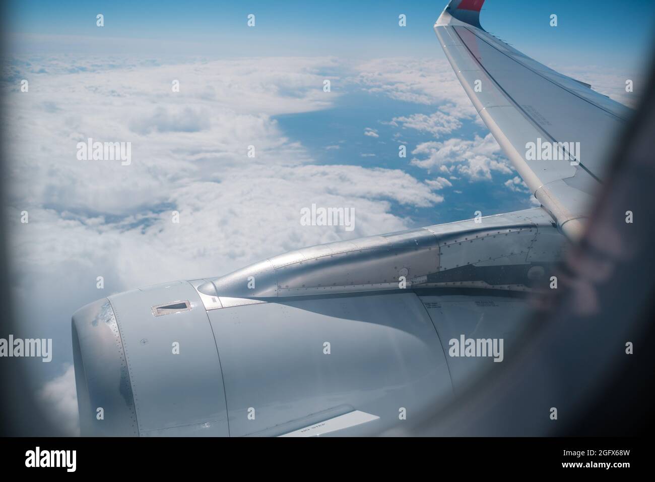 Plane turbine and wing behind window Stock Photo - Alamy
