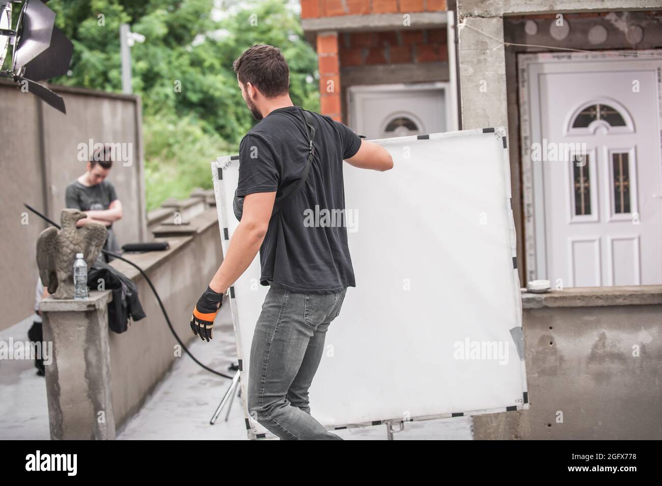 Behind the scene. Filmmaking lighting technician electric engineer ...