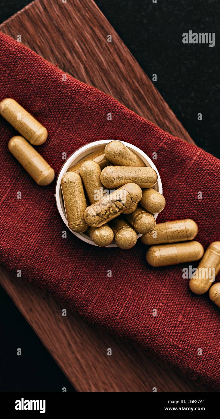 lion's mane supplement capsules on burlap rag. immune prevention care ...