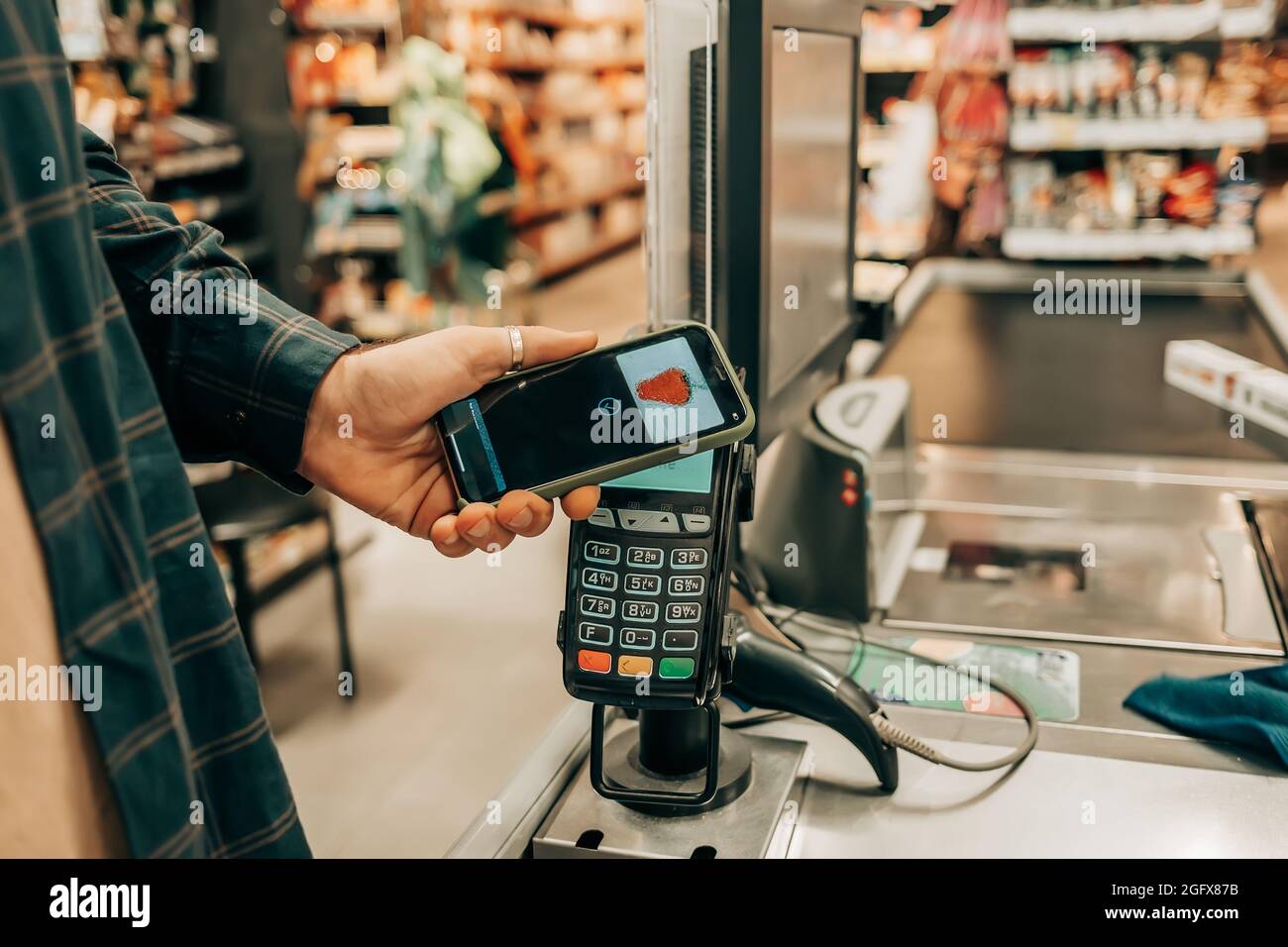 Customer buying food from cashier and paying at the till. Supermarket ...